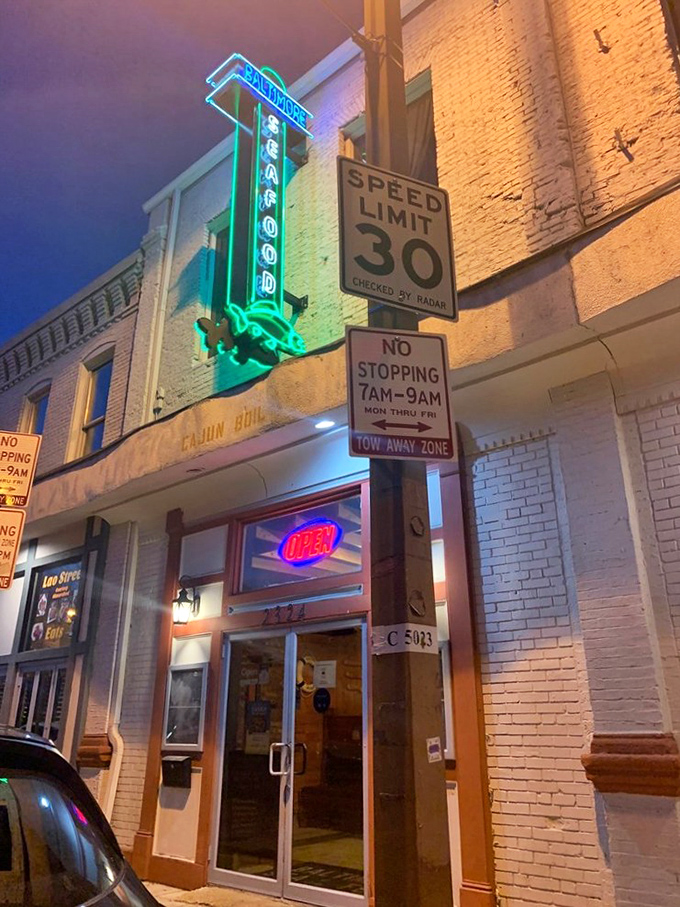 That vintage seafood sign beckoning from above promises culinary adventures that'll make your taste buds sing opera.