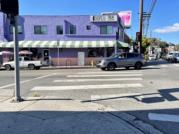 The purple palace of Cuban delights stands proudly on a Silver Lake corner, its green-striped awning beckoning hungry passersby like a tropical oasis.