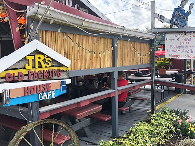 This charming red building with yellow railings proves the best food often hides behind the most unassuming facades.
