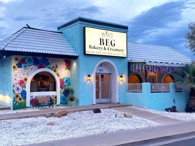 The turquoise oasis of BEG Bakery & Creamery beckons with its vibrant floral mural, promising sweet treasures that defy dietary restrictions with delicious rebellion.