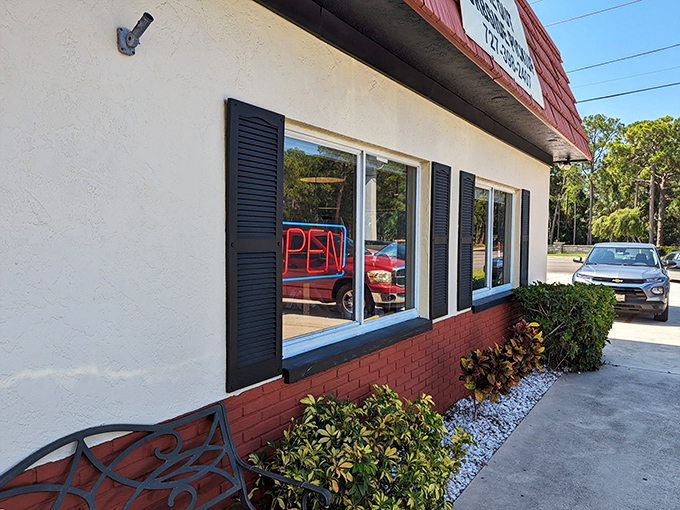 The classic red-roofed exterior of Doe Doe's beckons like an old friend, promising comfort food and zero pretension.