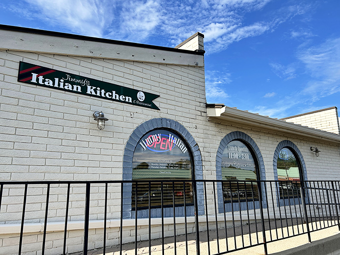 The unassuming white brick exterior of Jimmy's Italian Kitchen proves once again that culinary treasures often hide in plain sight.