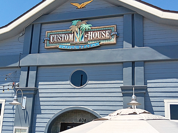 The blue-hued Custom House stands like a maritime postcard come to life, welcoming hungry travelers with the promise of ocean-fresh delights.