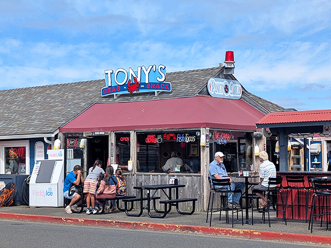 The coastal dream realized: Tony's Crab Shack's red-roofed exterior promises seafood paradise with its weathered charm and inviting outdoor seating.