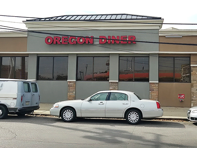 The Oregon Diner's iconic exterior stands proudly on Oregon Avenue, its bold red lettering a beacon for hungry South Philly locals and visitors alike.