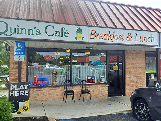 Quinn's welcoming storefront with its signature pineapple logo promises comfort food magic before you even step inside.