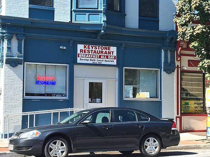 The blue facade of Keystone Restaurant stands like a beacon of breakfast hope in Harrisburg, promising "BREAKFAST ALL DAY" &ndash; four words that should be on Pennsylvania's state flag.