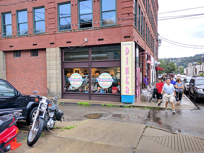 The iconic pink and blue corner of Pamela's Diner beckons hungry Pittsburghers like a breakfast lighthouse in the Strip District.