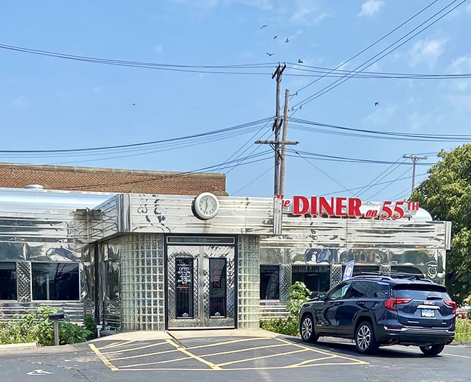 The gleaming stainless steel exterior of The Diner on 55th stands like a time capsule in Cleveland, beckoning hungry travelers with its retro red signage and nostalgic charm.