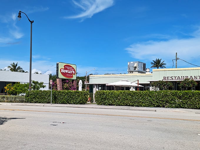 Mint-green dreams and retro vibes! Howley's iconic exterior stands as a time capsule of mid-century charm in West Palm Beach's bustling landscape.