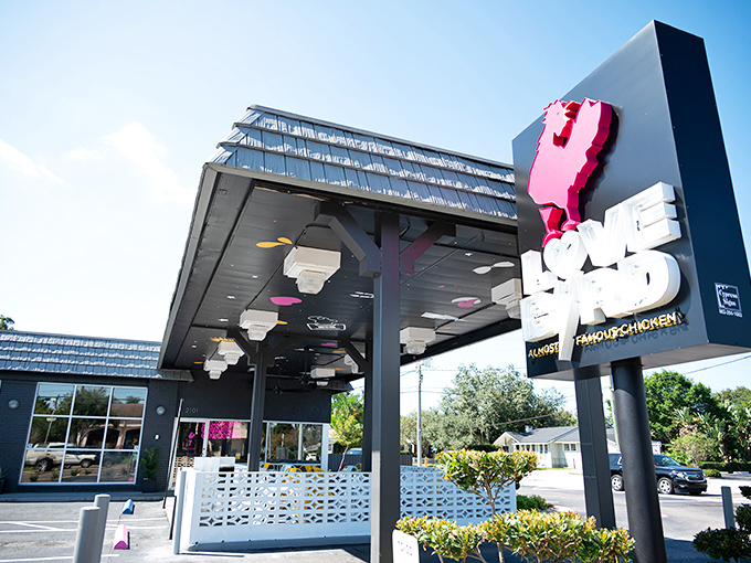 LoveBird's exterior screams "rock star chicken joint" with its bold signage and modern design. Pink chicken silhouette? Absolutely necessary.