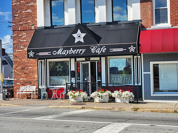 The iconic black awning with silver stars welcomes you to Mayberry Cafe, where nostalgic Americana meets small-town Indiana charm on Danville's courthouse square.