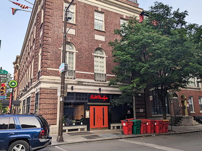 That classic red neon glow promises serious comfort food hiding behind those welcoming doors.