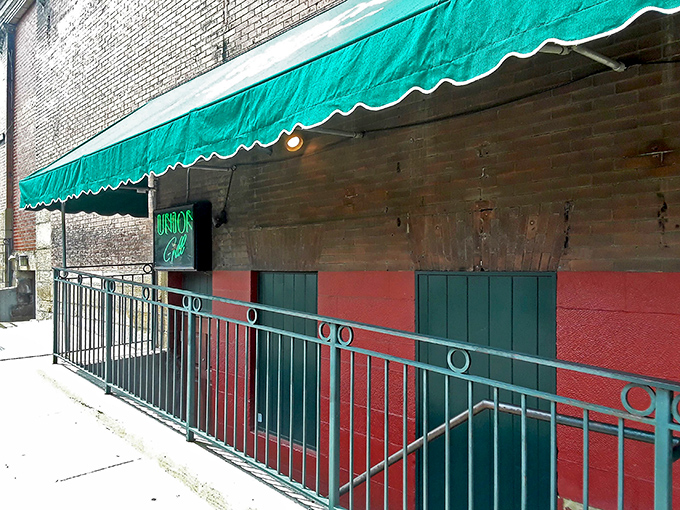 The unassuming exterior of The Union Grill hides culinary treasures like a speakeasy hides good whiskey. That green awning is your beacon to flavor town.