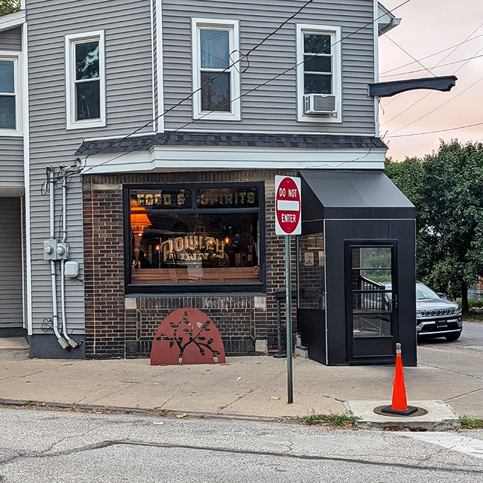 The corner entrance to The Rowley Inn beckons like an old friend, its vintage sign promising comfort and camaraderie in Cleveland's historic Tremont neighborhood.