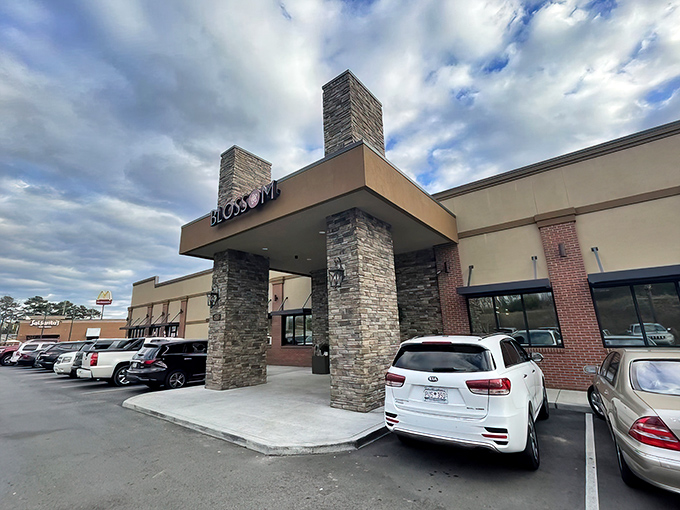 The glowing red Blossom sign beckons hungry travelers like a culinary lighthouse, promising delicious refuge from mundane meals.