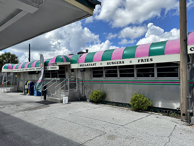 The pink and green striped awning of Angel's Dining Car stands out like a beacon of breakfast hope in downtown Palatka.