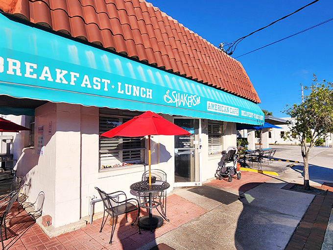 The turquoise awning beckons like a breakfast lighthouse amid Orlando's sea of theme parks. This unassuming exterior hides culinary treasures within.