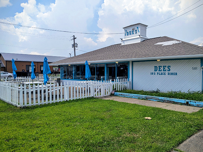 The classic white picket fence and blue umbrellas aren't just charming &ndash; they're a promise that inside this unassuming Barberton treasure, calorie counting is strictly prohibited.