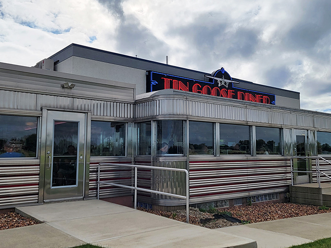 The gleaming stainless steel exterior of Tin Goose Diner shines like a beacon of hope for hungry travelers. Classic Americana at its finest.