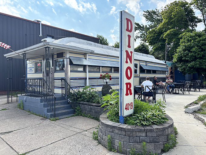 The gleaming silver exterior of Park Dinor stands as a time capsule of Americana, complete with that iconic "DINOR" sign spelling that's uniquely northwestern Pennsylvania.