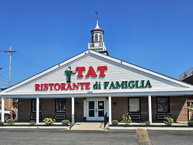 The iconic white facade of TAT Ristorante Di Famiglia stands proudly in Columbus, its red and green signage a beacon for Italian food lovers since 1929.