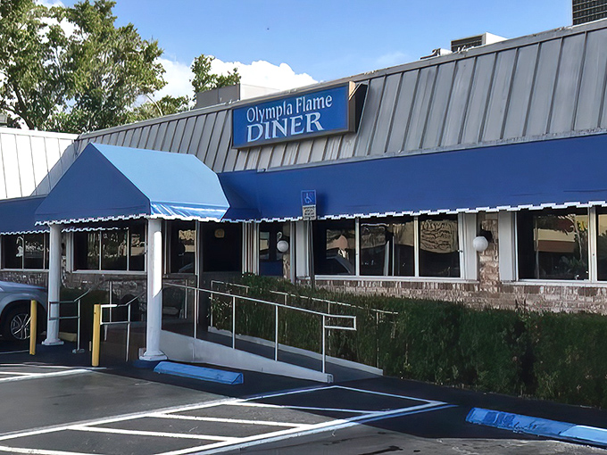 The iconic blue awning of Olympia Flame Diner stands as a beacon of comfort food in Deerfield Beach, promising Greek-inspired delights inside.