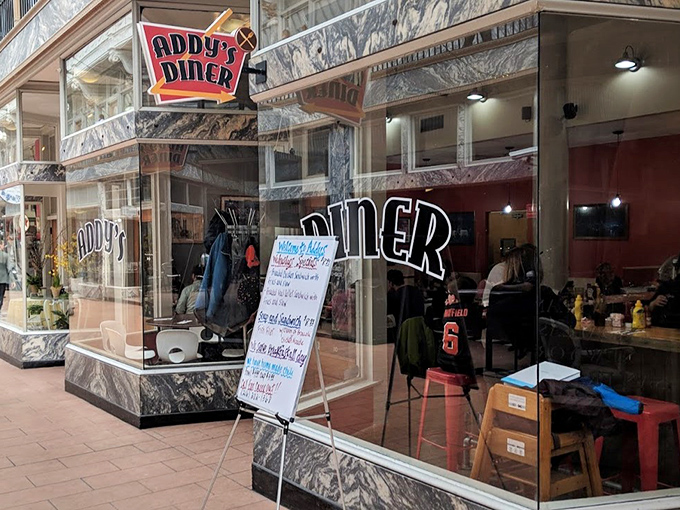 Addy's classic storefront beckons with marble accents and neon signage&mdash;like a time portal to when breakfast was an art form, not just a meal.