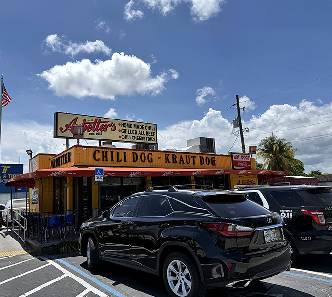 The unmistakable yellow and red beacon of Arbetter's stands proud against Miami's blue sky, promising hot dog perfection to those in the know.