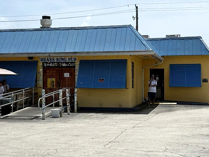 The unassuming yellow exterior with bright blue shutters is Florida's version of a treasure chest – inside lies burger gold instead of pirate booty.