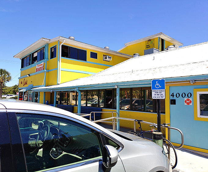 The yellow and turquoise exterior promises tropical vibes, and trust me, it delivers on every sunny Florida promise.