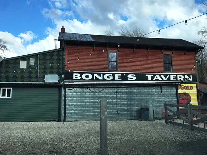 The unassuming red exterior of Bonge's Tavern stands like a culinary mirage in rural Indiana, promising legendary steaks to those who make the pilgrimage.