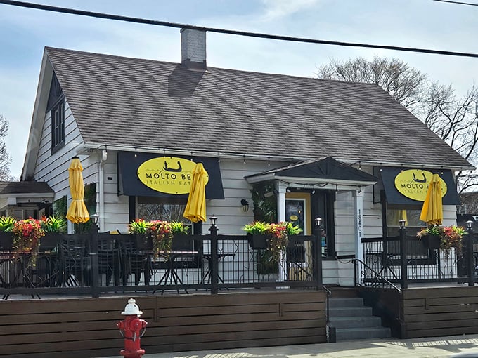 The unassuming yellow door with its simple "Be Kind" message is like a secret password to pasta paradise in Lakewood.