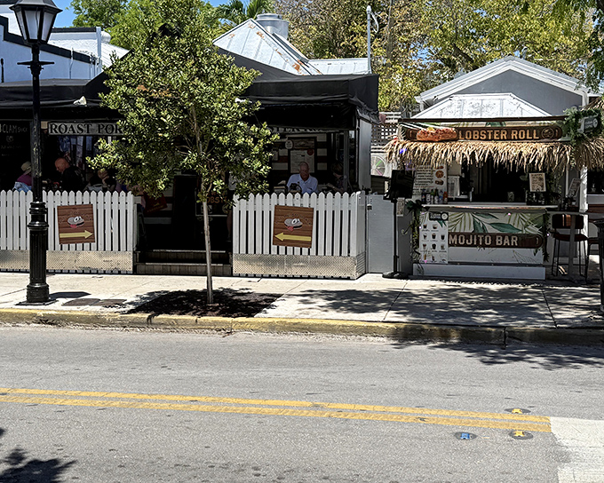 DJ's Clam Shack's charming exterior on Duval Street proves that seafood paradise often comes in small, unassuming packages with white picket fences.