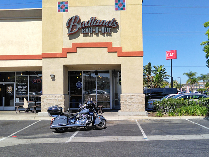 The Western-inspired facade of Badlands BBQ welcomes meat lovers with the promise of smoky delights. Even the motorcycle seems to know where the good stuff is.