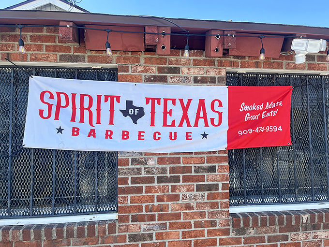 The red and white banner against brick says it all: "Smoked Meats, Great Eats!" A promise that Spirit of Texas Barbecue delivers on spectacularly.