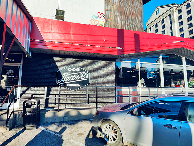That iconic red awning isn't just a design choice&mdash;it's Nashville's equivalent of a lighthouse, guiding hungry souls to hot chicken paradise.