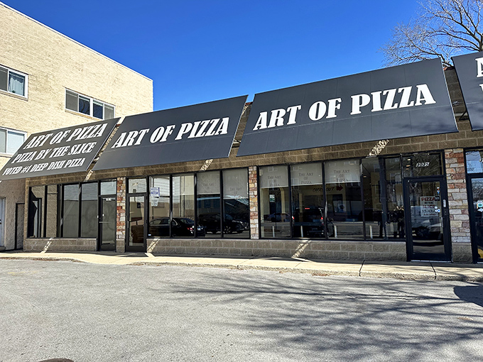 The unassuming storefront of Art of Pizza stands like a humble guardian of flavor on Ashland Avenue, its simple signage belying the culinary treasures within.