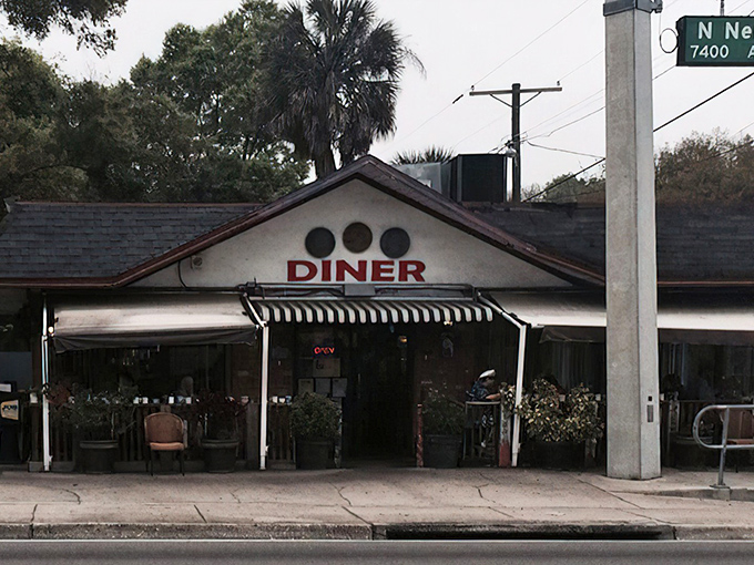 Three coins on the facade aren't just decoration&mdash;they're a promise of the culinary treasures waiting inside this unassuming Tampa landmark.