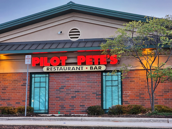 As dusk settles, Pilot Pete's neon sign glows like a runway beacon, guiding hungry travelers to this suburban oasis of comfort food and flight-inspired fun.