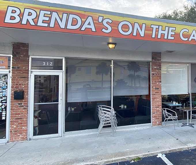 The unassuming storefront that houses breakfast dreams. Brenda's bright orange sign beckons hungry travelers like a lighthouse for empty stomachs.