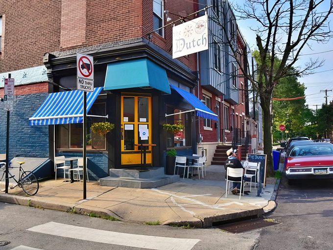 This corner spot in East Passyunk has the architectural equivalent of a firm handshake &ndash; sturdy brick, welcoming blue awnings, and just enough sidewalk seating for the optimists.