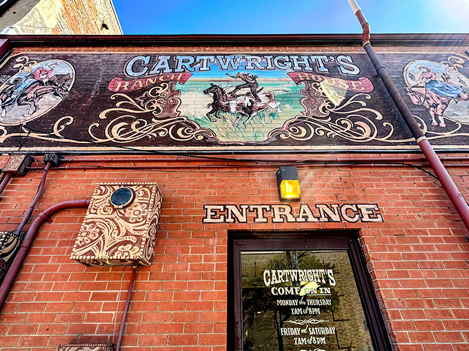 The brick facade of Cartwright's Ranch House promises authentic Texas dining with its vintage-style mural that practically screams "Come get your comfort food here, partner!"