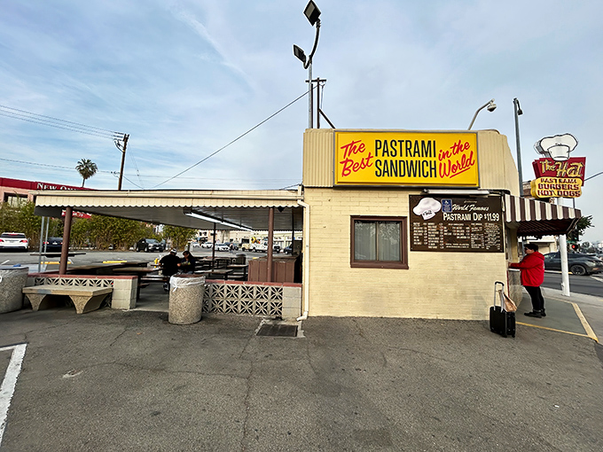 The iconic yellow and red exterior of The Hat in Alhambra stands as a beacon of pastrami perfection, promising culinary salvation to sandwich seekers.