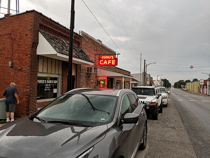 Main Street Americana at its finest&mdash;Cooky's red neon sign glows with promise, beckoning hungry travelers to pull over and discover what locals already know.