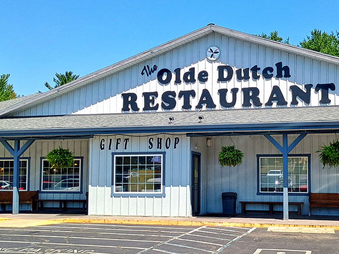 The white clapboard exterior of Olde Dutch Restaurant stands like a beacon of comfort food promise in Logan, Ohio&mdash;complete with hanging plants that somehow survive despite being constantly tempted by pie aromas.