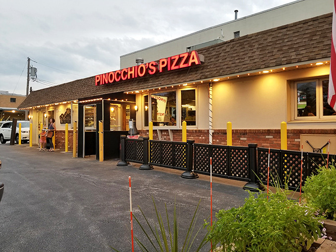 The unassuming entrance to Pinocchio's might not scream "food paradise," but locals know this modest storefront houses pizza dreams worth chasing.