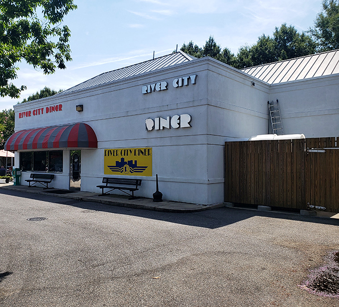 The classic white exterior with its red and blue awning stands like a time capsule in Midlothian, promising comfort food treasures within.