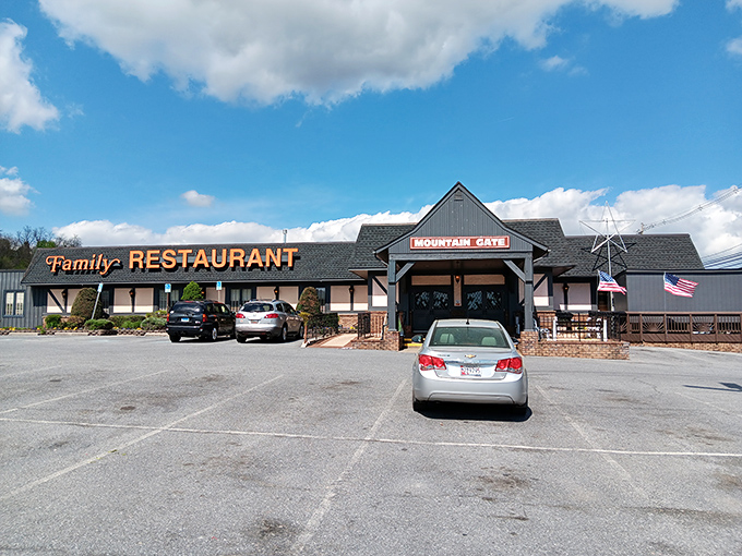 The Tudor-style facade of Mountain Gate Family Restaurant stands proudly against Maryland's blue skies, promising comfort food and country charm before you even step inside.