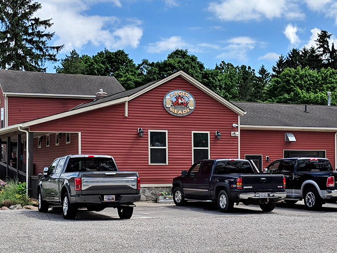 The bright red exterior of Lager Heads stands like a beacon of barbecue hope in Medina, promising smoky delights within those humble walls.